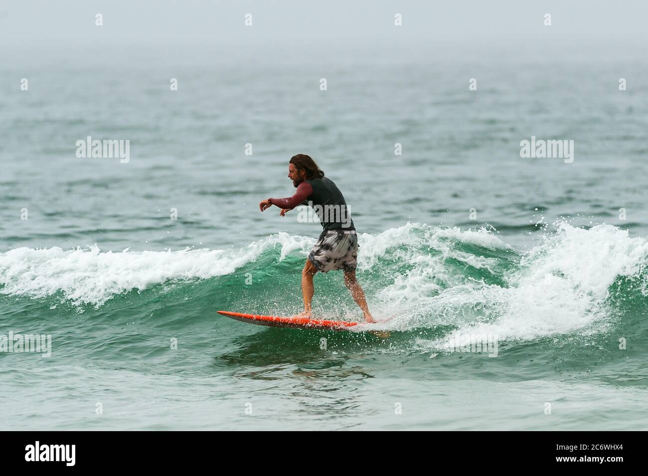 Man surfing at Venice Beach in Los Angeles, California Stock Photo - Alamy