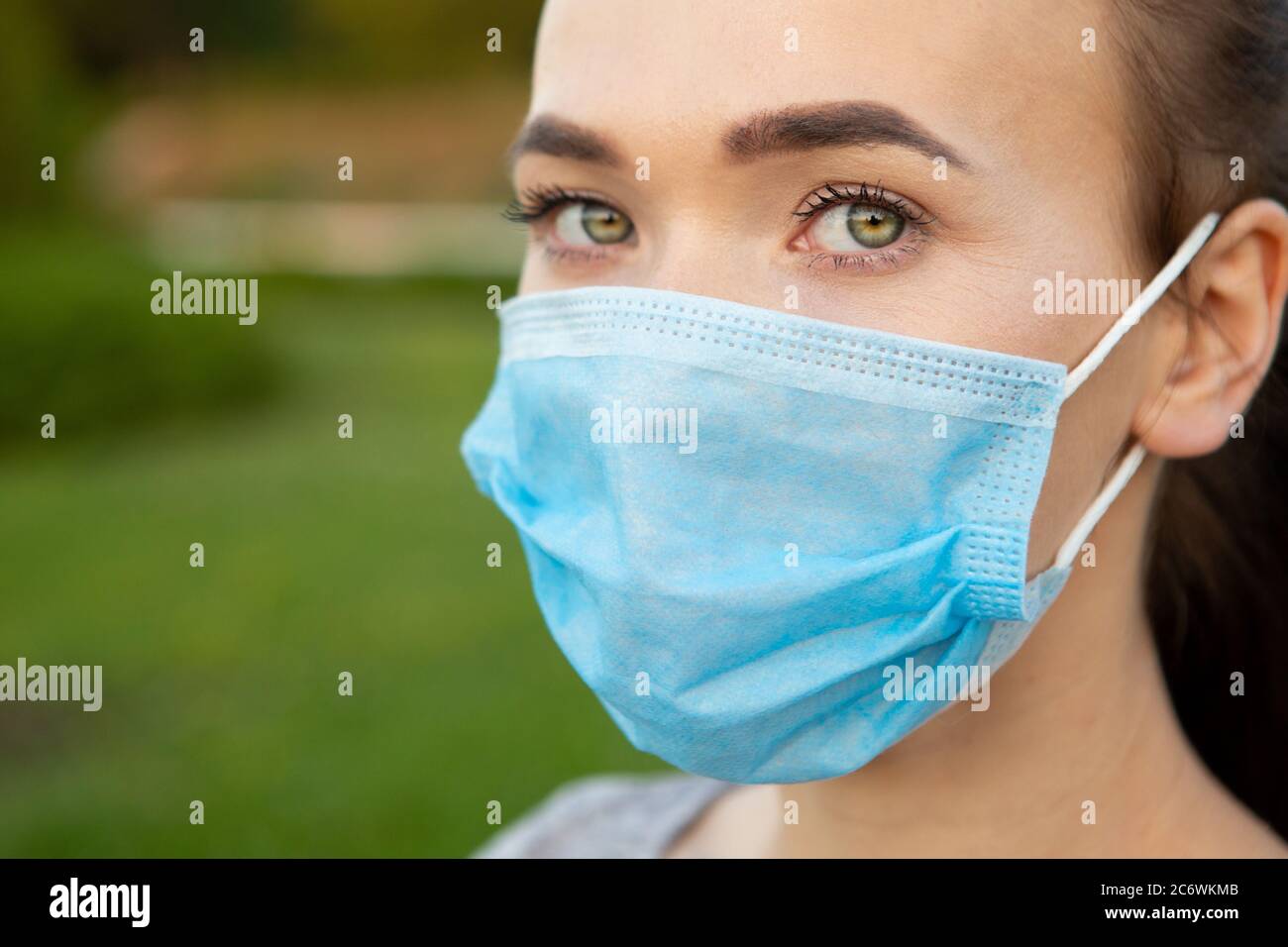 Beautiful Women In A Medical Blue Mask Stock Photo - Alamy