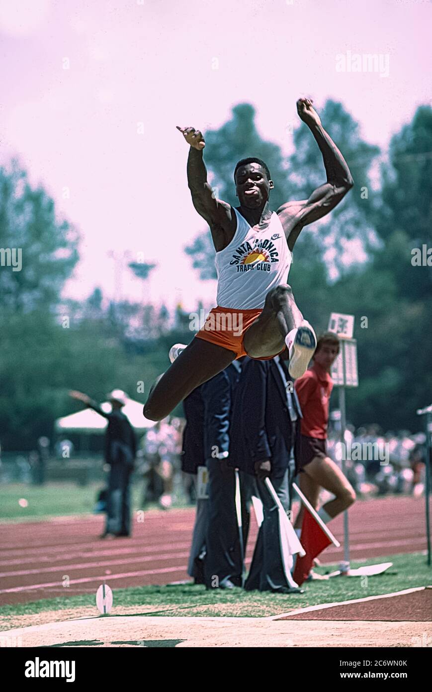 Carl Lewis competing the long jump at the 1984 US Pepsi Invitational ...
