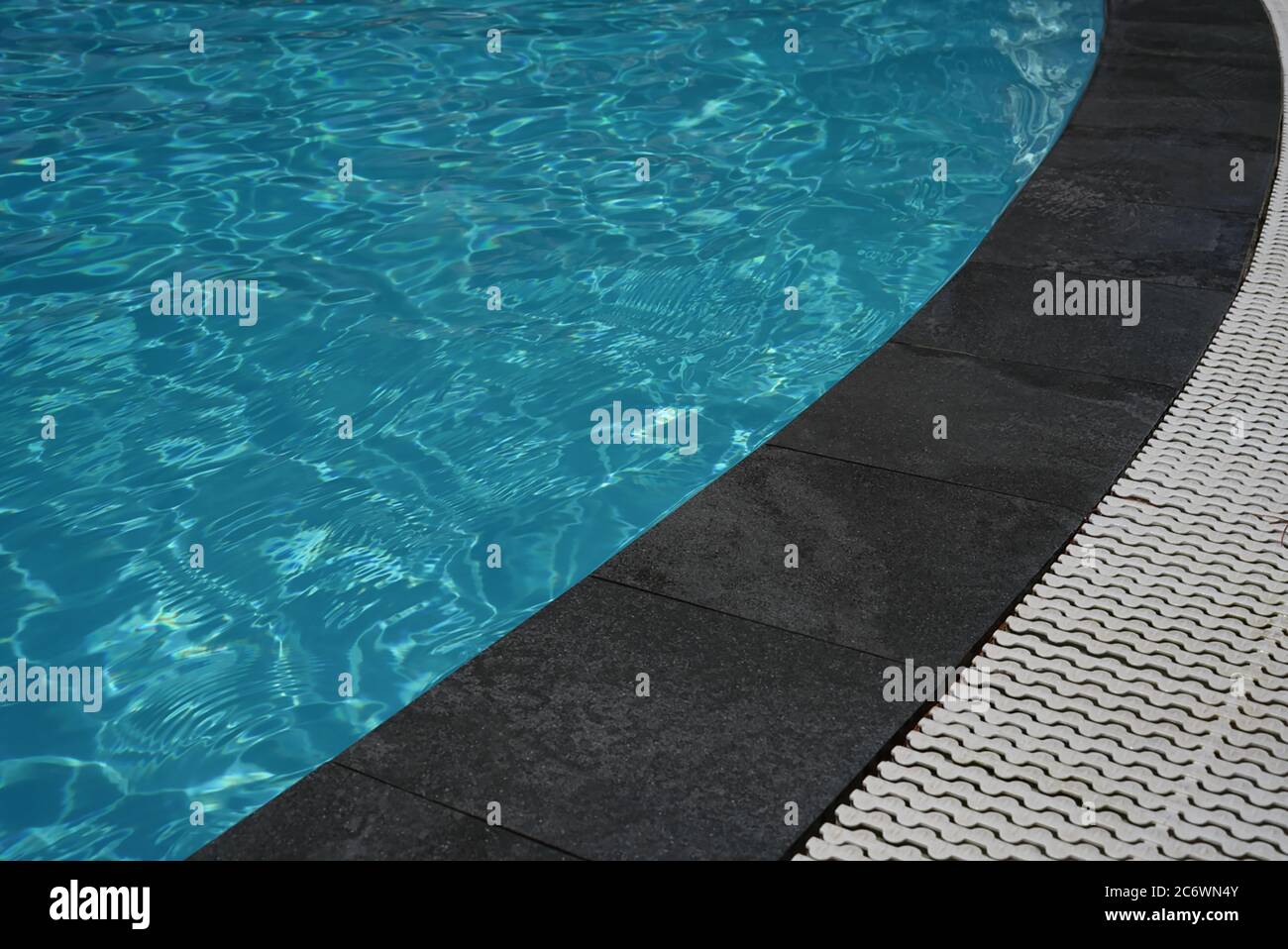Open swimming pool bord, water and black marble texture. Vacation ...