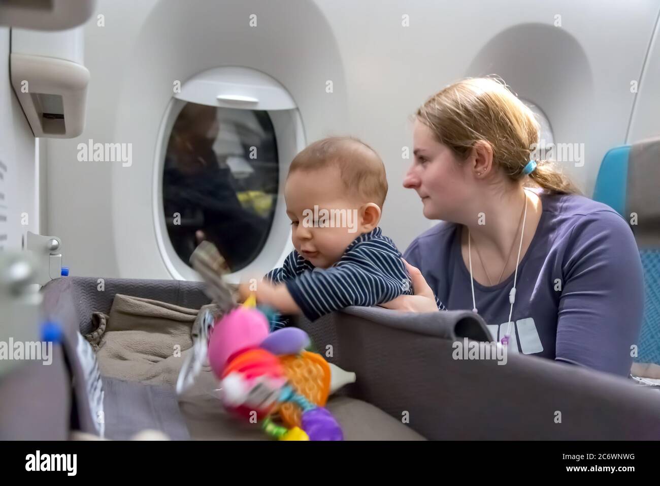 Interest to special baby bassinet during the flight. First flight of ...
