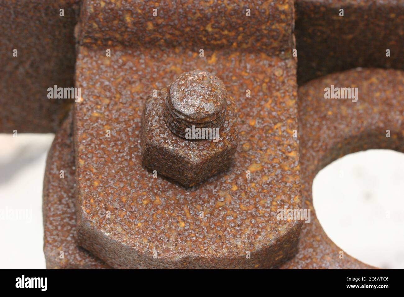 Rusty textured flange and bolt with nut on white sand beach Stock Photo ...