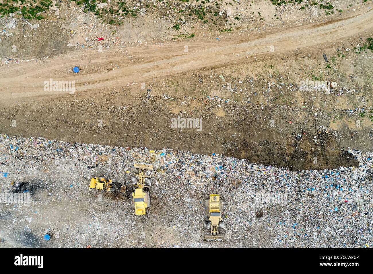 Garbage pile in trash dump or landfill. Dump trucks and excavators ...