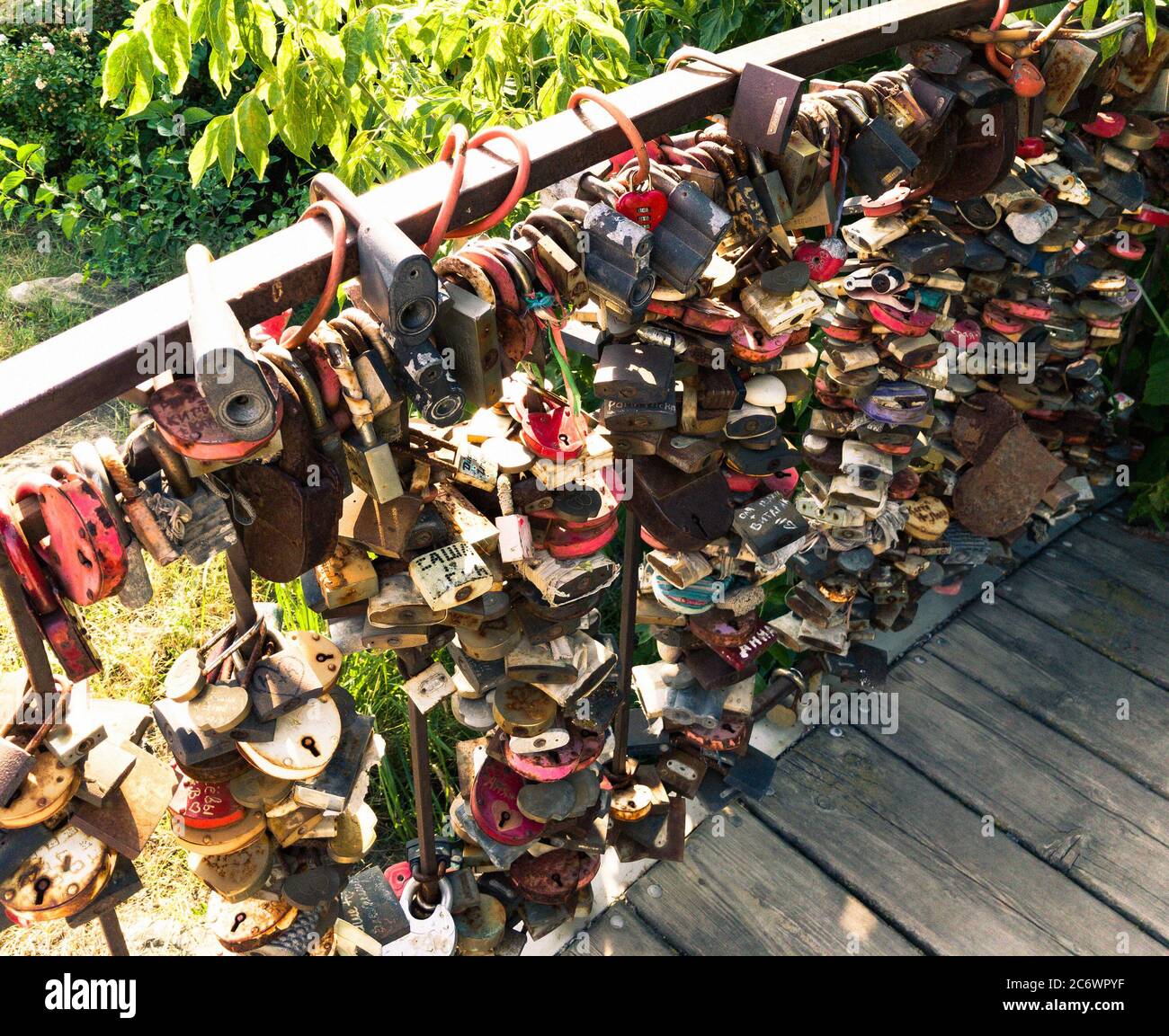 Russian traditional newlyweds bridge in park Stock Photo - Alamy