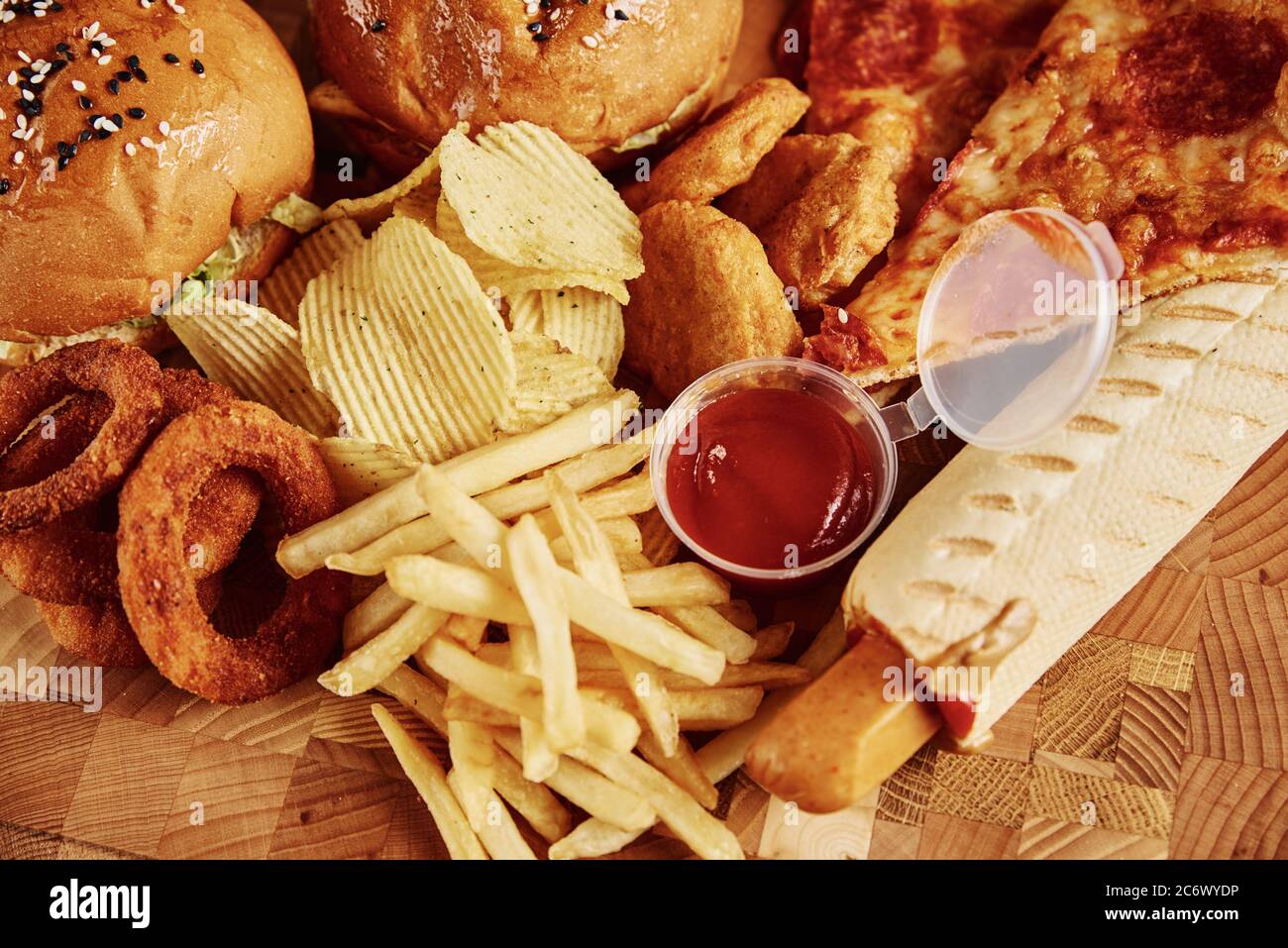 Unhealthy and junk food. Different types of fast food on the table ...