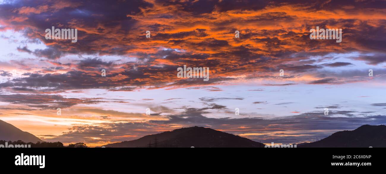 Colorful sun set horizon and remote hill Stock Photo - Alamy
