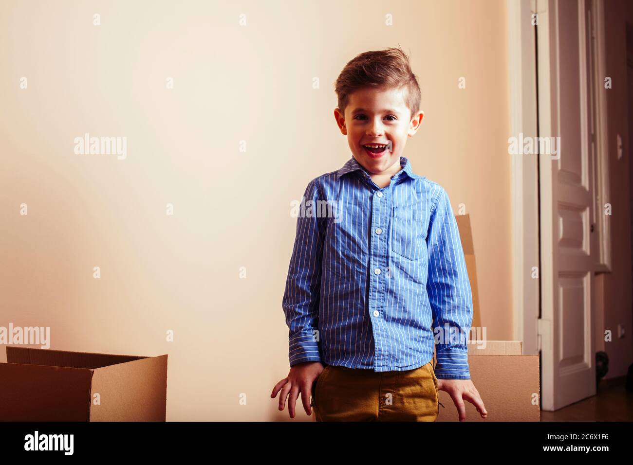 little cute boy in empty room, move to new house. home alone among ...