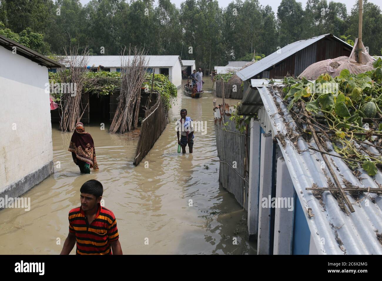 Flood affected people seen at a shelter center during the monsoon flood ...