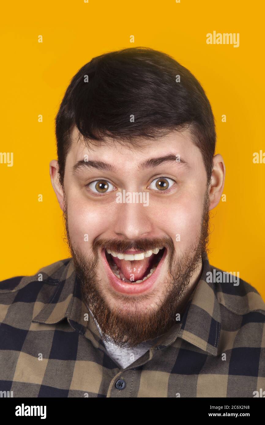 funny comic man smiling on a yellow background Stock Photo - Alamy