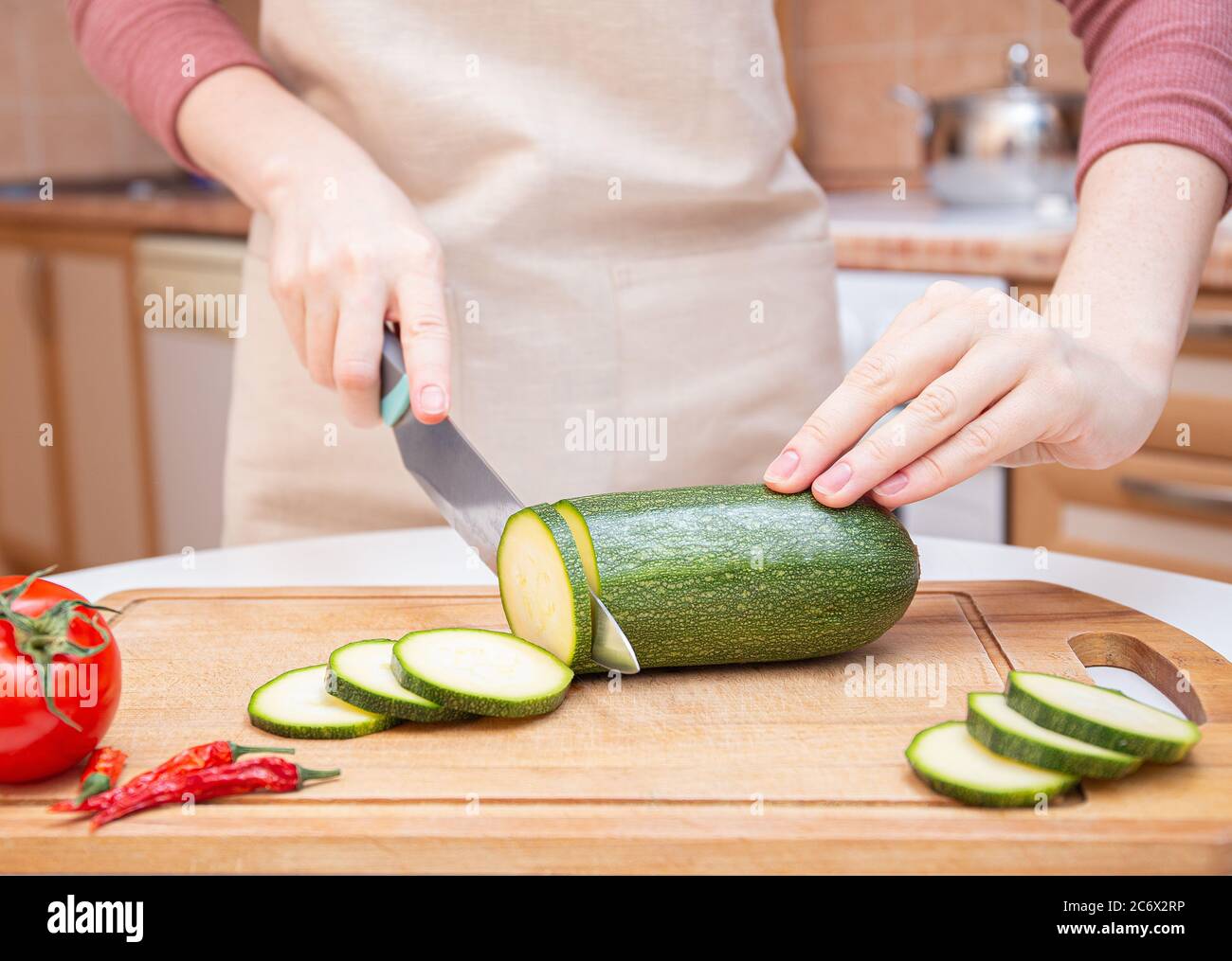 Zucchini cutting knife slices hi-res stock photography and images - Alamy