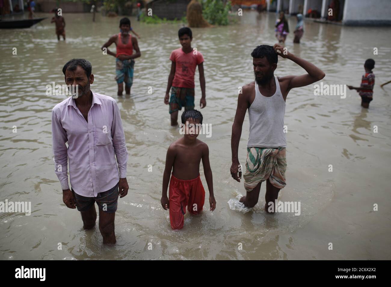 Flood affected people seen at a shelter center during the monsoon flood ...
