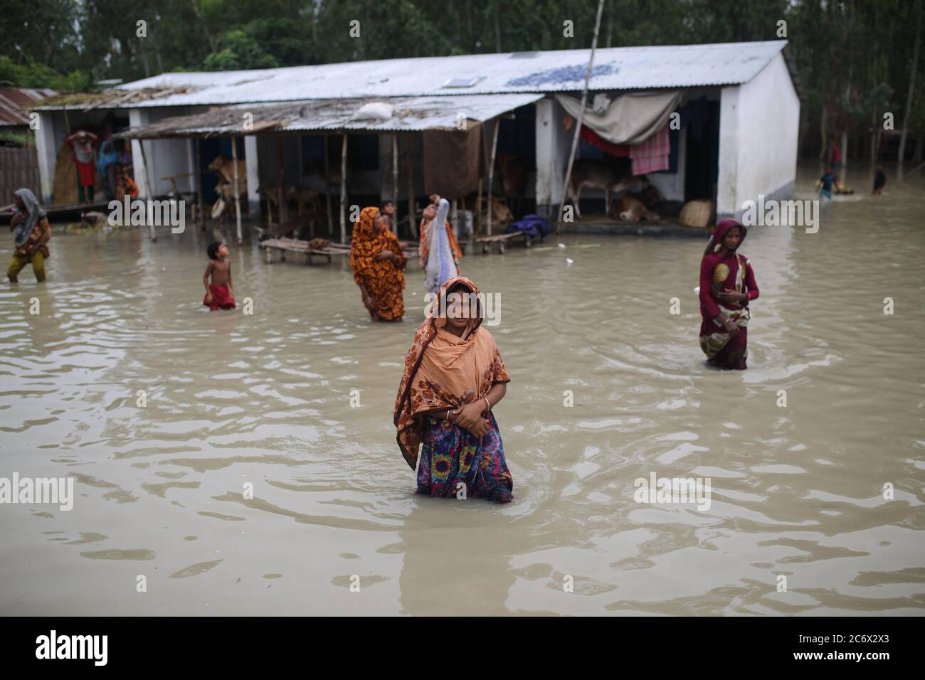 Flood affected people seen at a shelter center during the monsoon flood ...