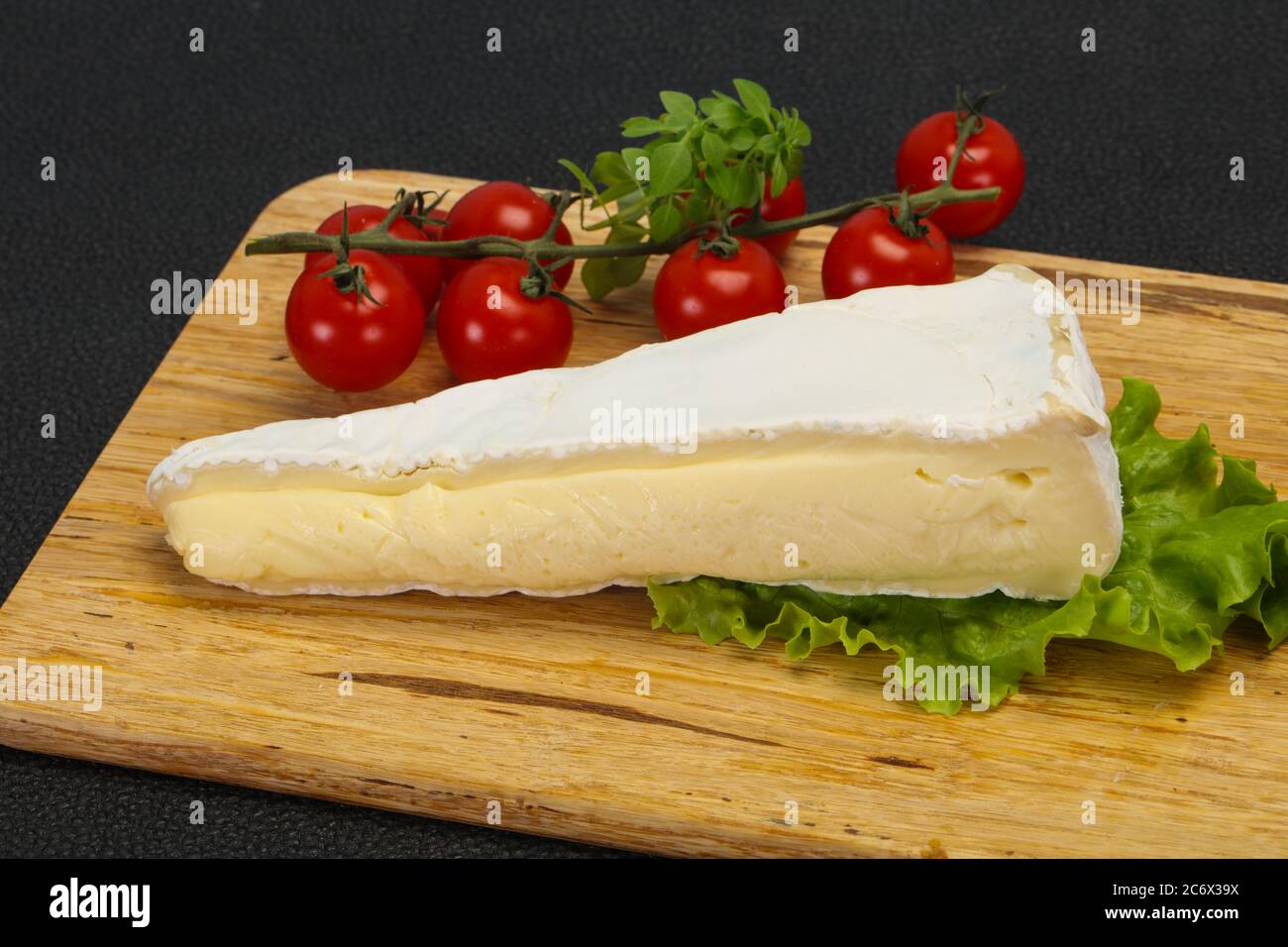 Brie cheese triangle served salad leaves Stock Photo - Alamy