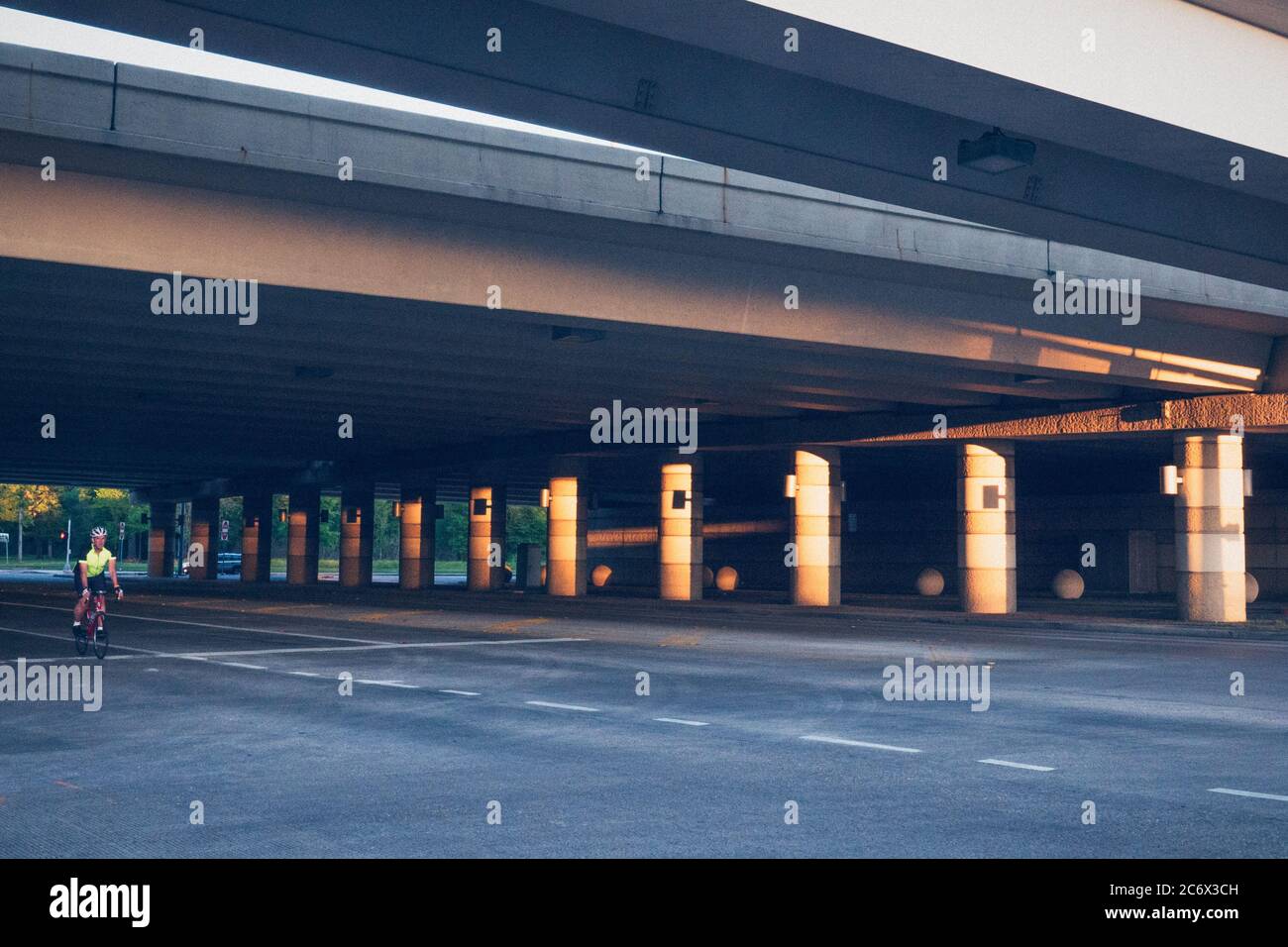 Man on the bicycle under overpass, city of Houston USA Stock Photo - Alamy