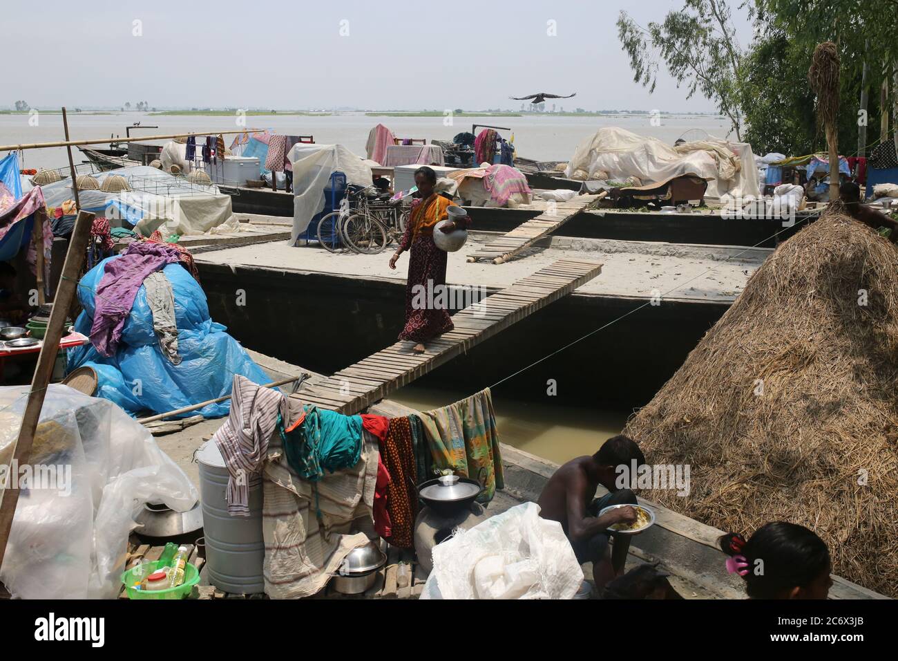 Flood affected people take shelter on boats during the monsoon flood in ...