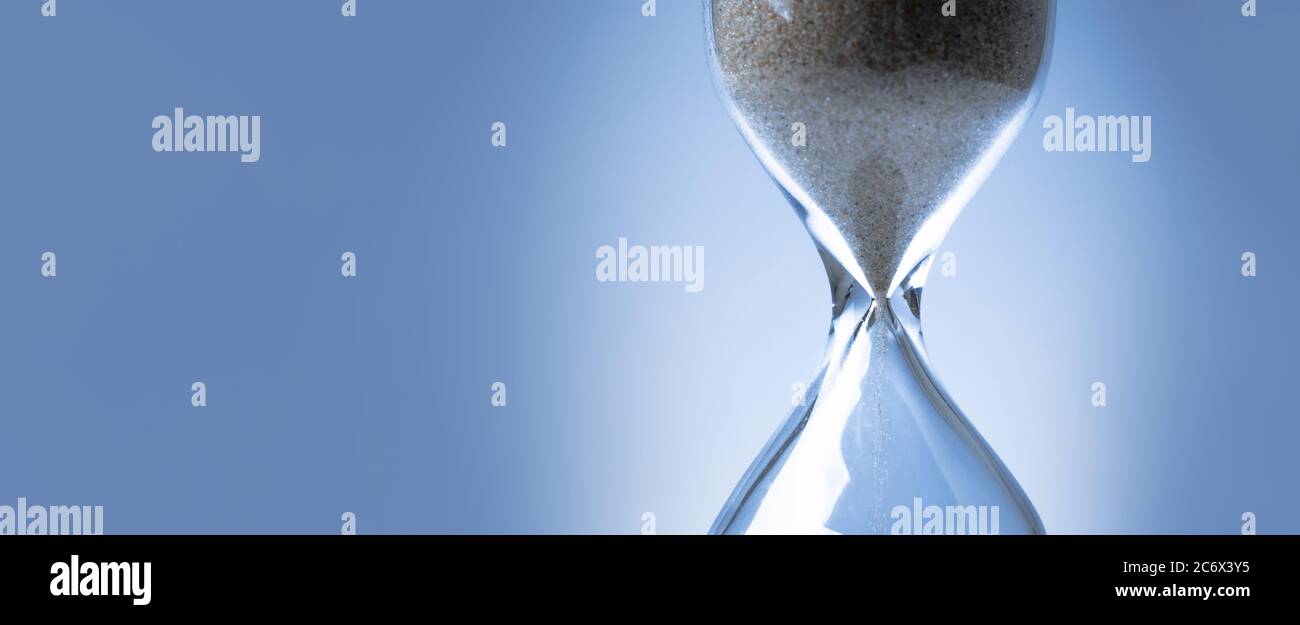 Sand flowing through an hourglass concept for time running out ...