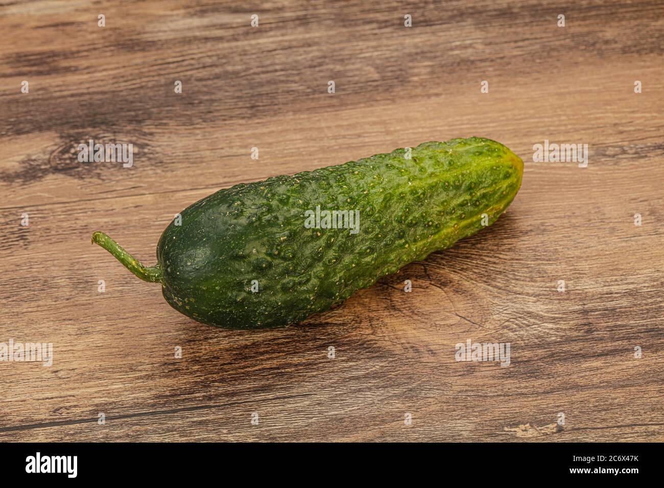Green ripe fresh one cucumber over background Stock Photo - Alamy