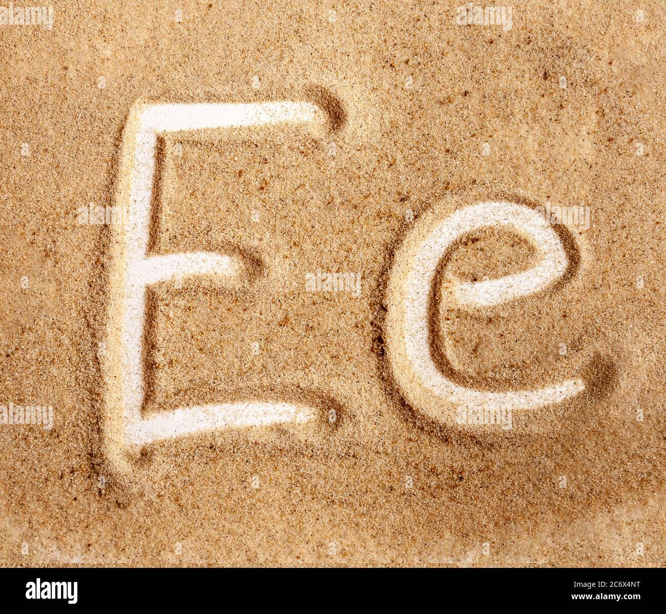 Letter E. English Handwritten Alphabet In The Sand Stock Photo - Alamy