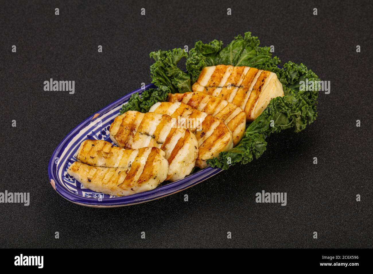 Grilled Greek haloumi cheese with herbs and spices Stock Photo - Alamy