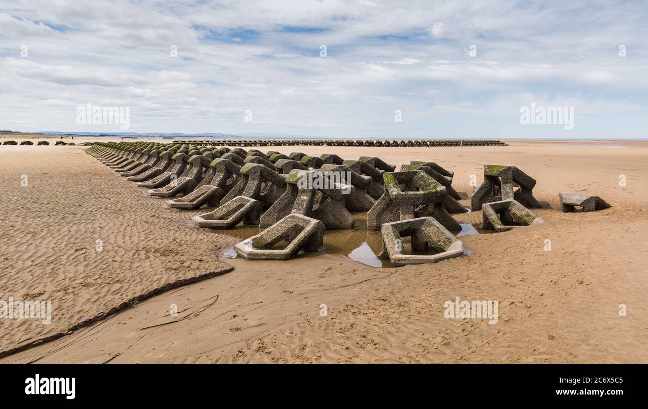 Sea defences on Wallasey beach seen in July 2020 near Liverpool Stock ...