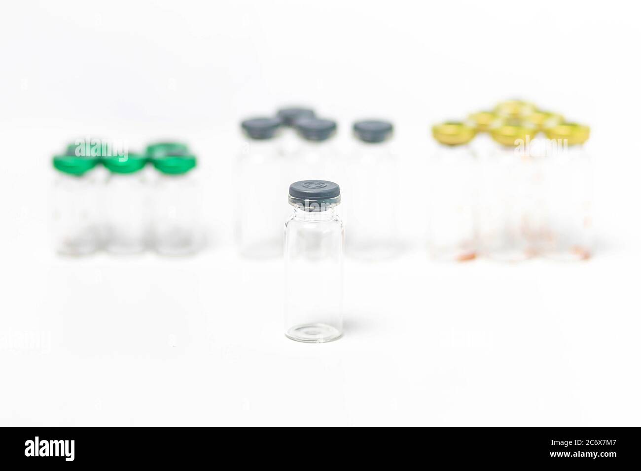Clean and empty medical vials with caps isolated on white background ...
