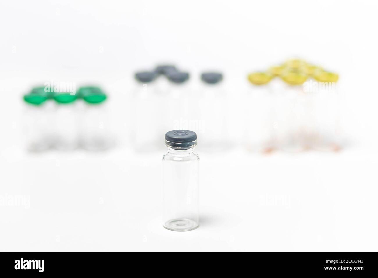 Clean and empty medical vials with caps isolated on white background ...
