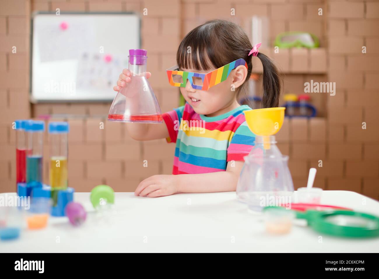 toddler girl play science experiments for homeschooling Stock Photo - Alamy