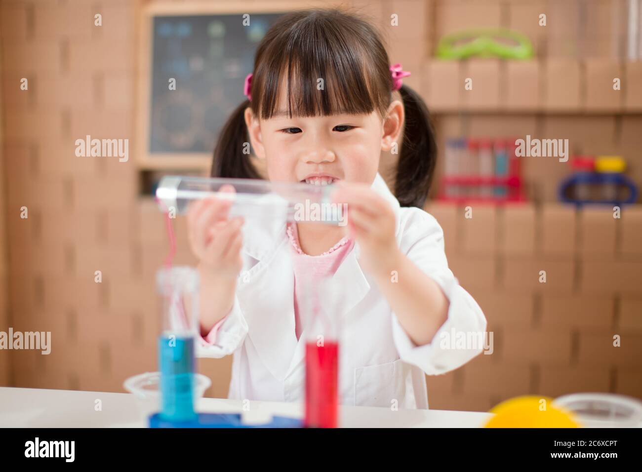toddler girl play science experiments for homeschooling Stock Photo - Alamy