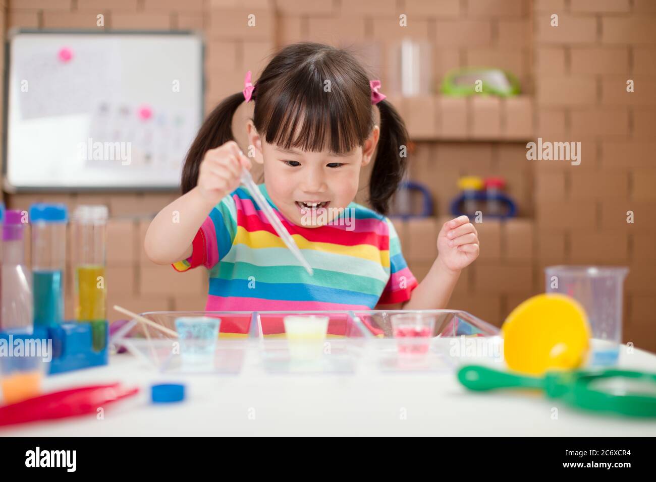 toddler girl play science experiments for homeschooling Stock Photo - Alamy