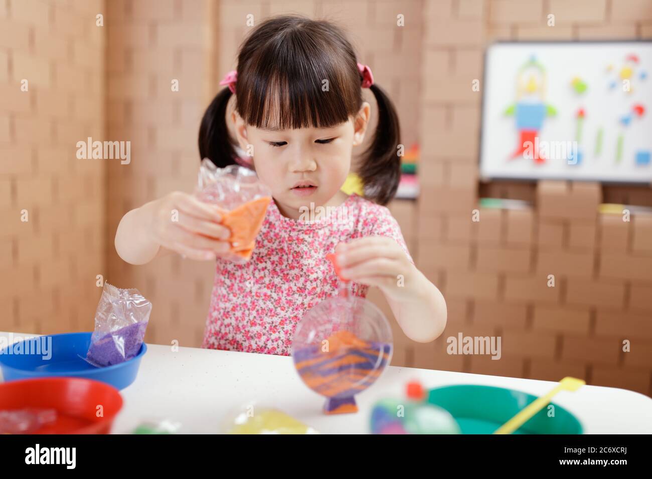 toddler girl making sand animal crafts for homeschooling Stock Photo ...
