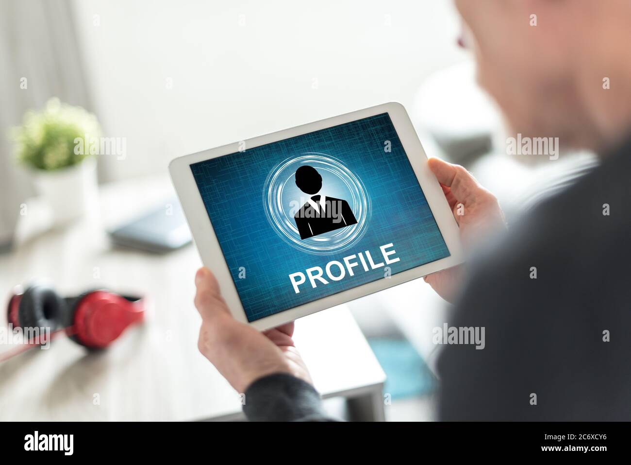Tablet screen displaying a profile concept Stock Photo - Alamy