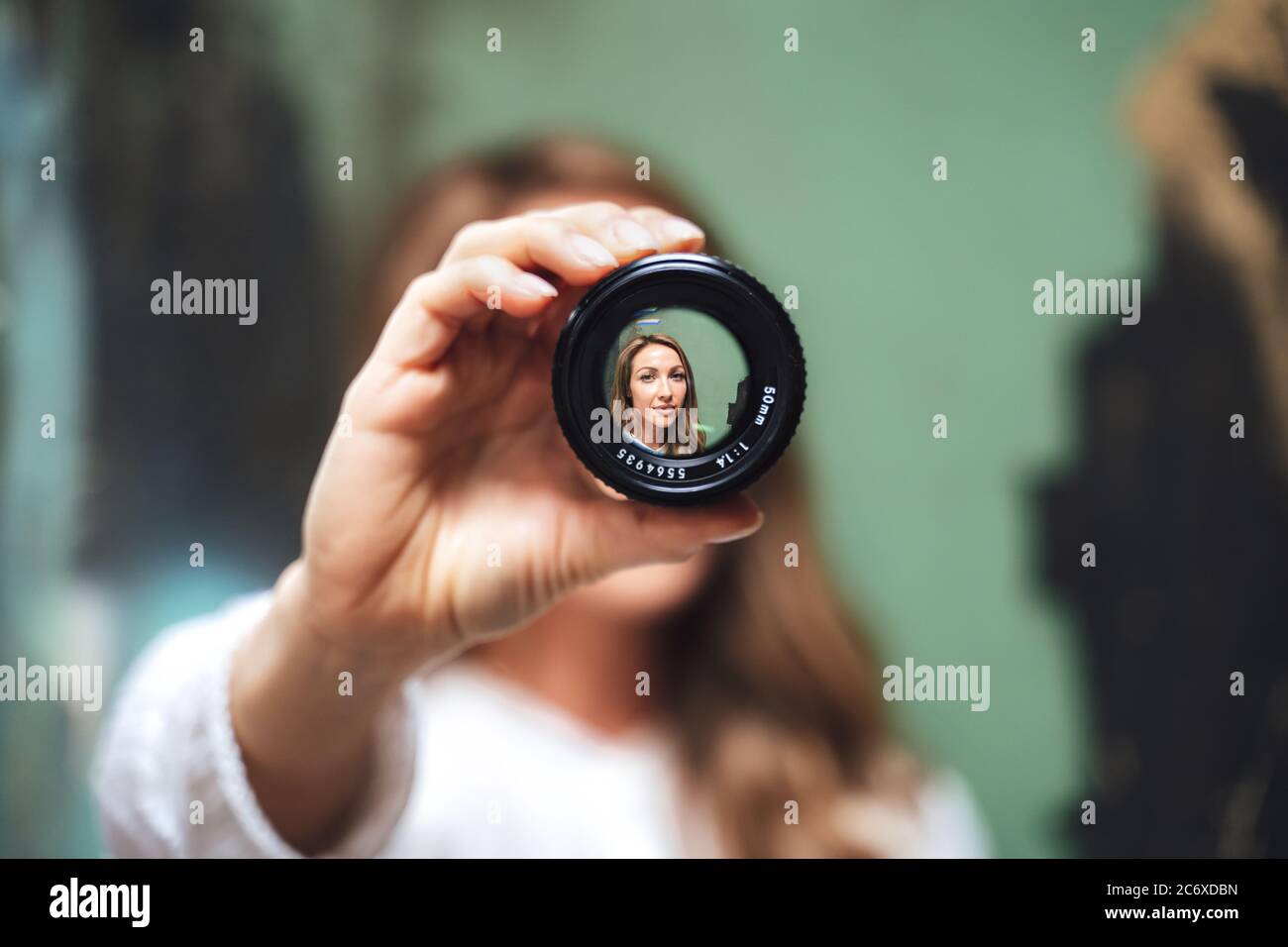 Woman looking glass magnify man hi-res stock photography and images - Alamy