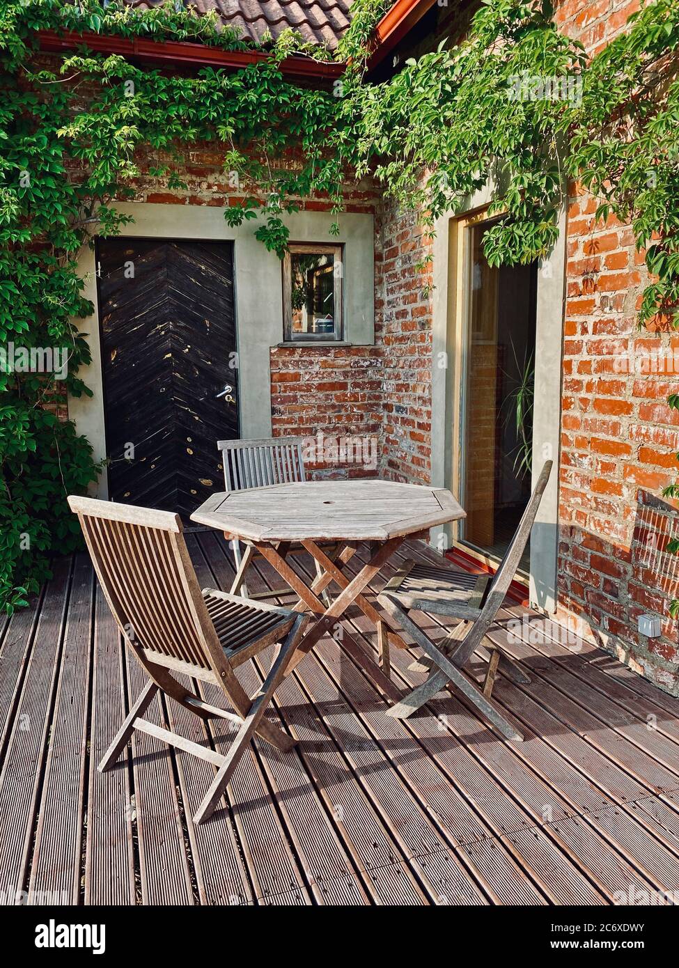 summer terrace with wooden table and chairs, sitting area Stock Photo ...