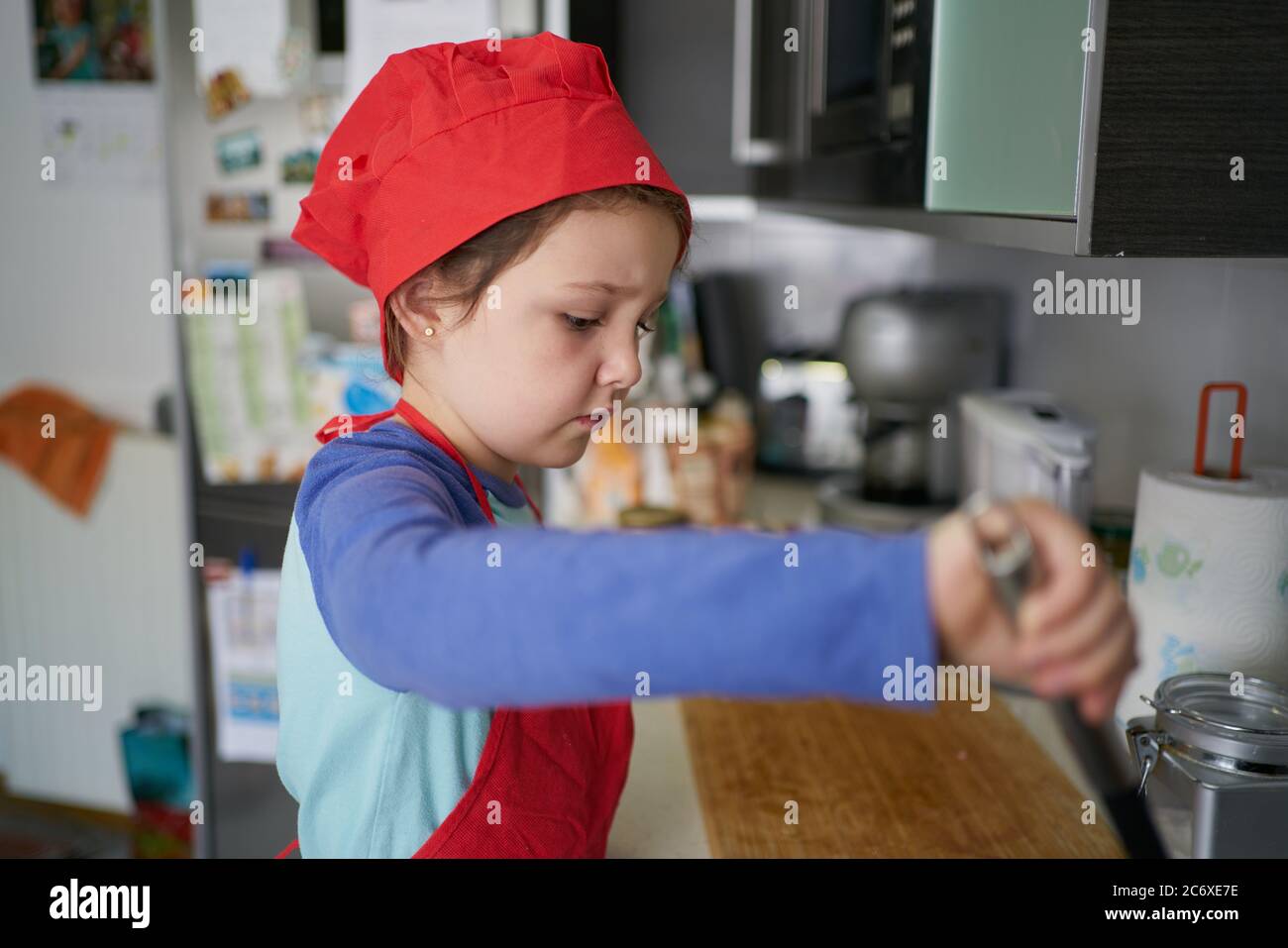 Woman cooking with chefs hat hi-res stock photography and images - Alamy