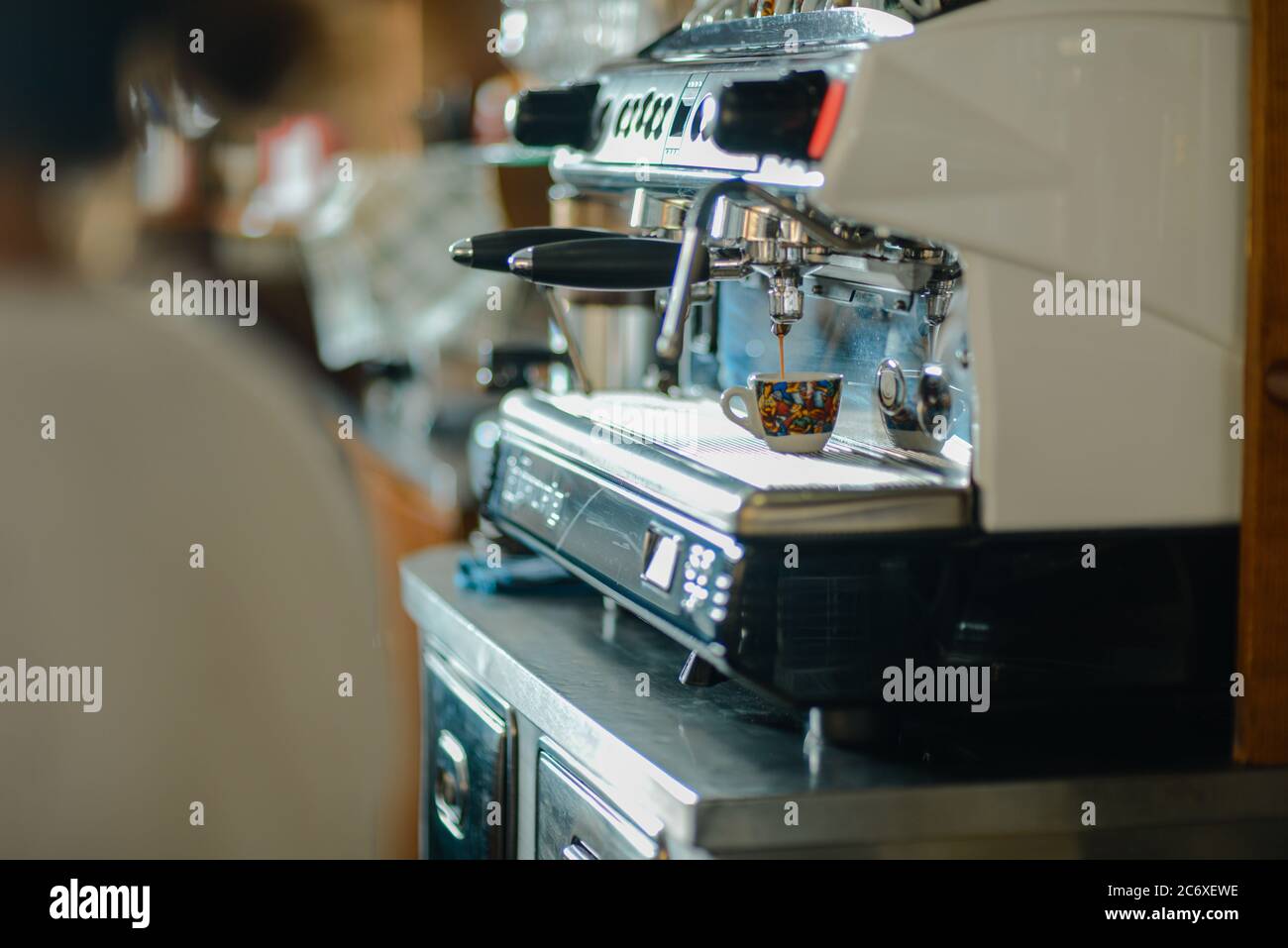 Italian espresso machine on a counter in a restaurant dispensing Stock ...