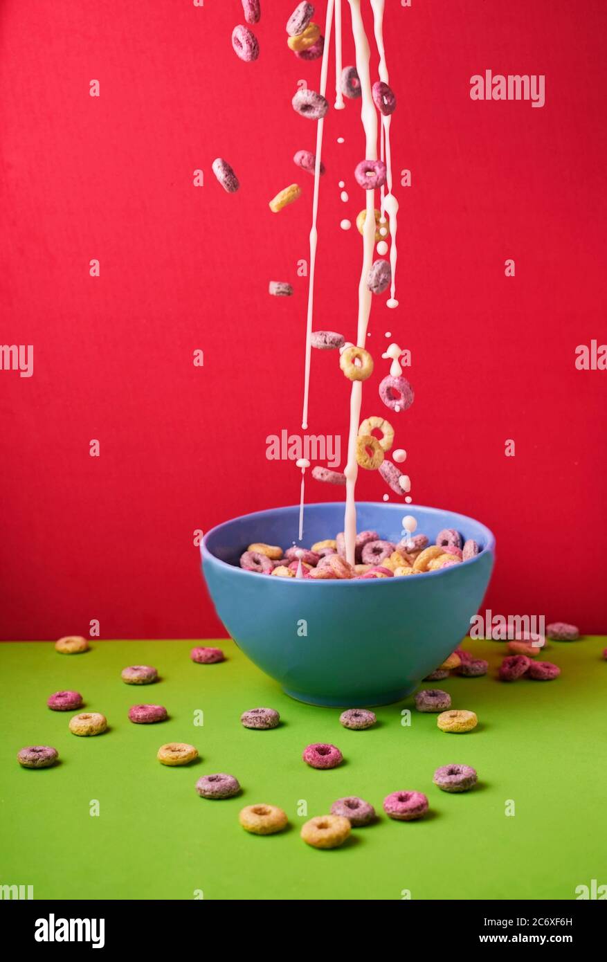 milk with colored cereals flying Stock Photo - Alamy
