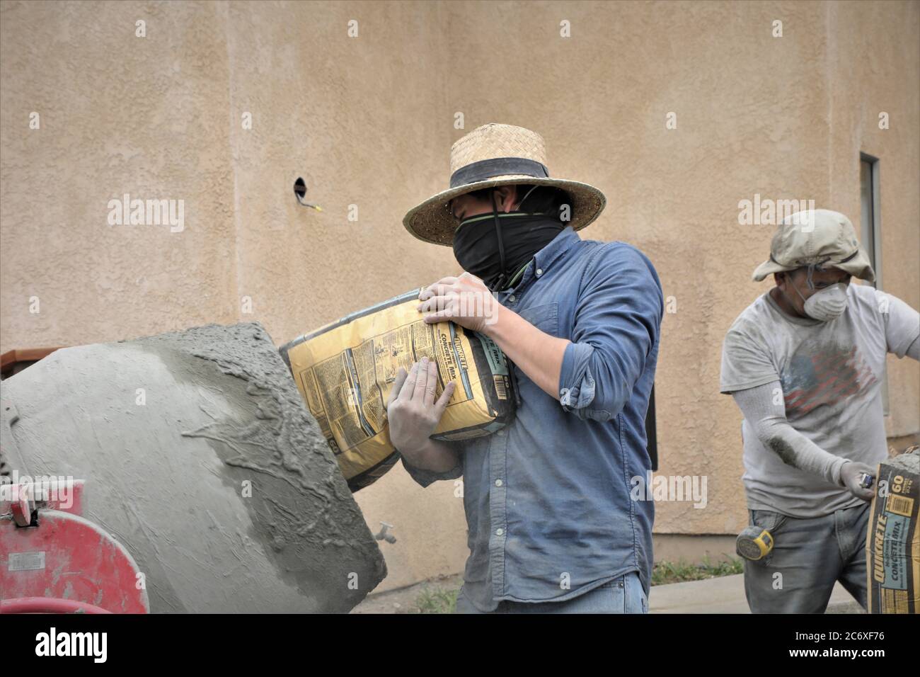 Mexican labor building a cement retaining wall overlooking Morro Bay ...
