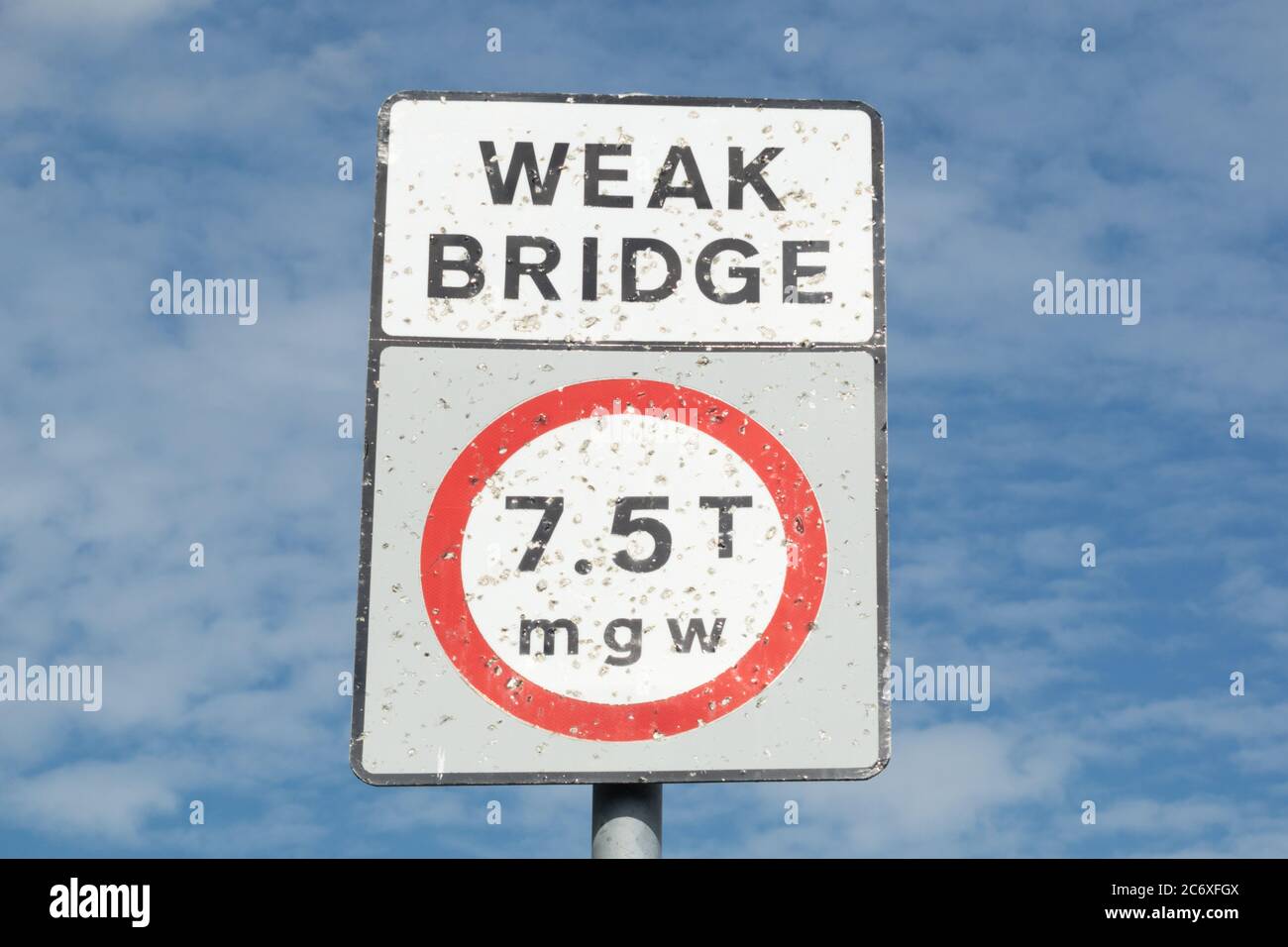A road sign stating "WEAK BRIDGE 7.5t mgw" which has been repeatedly ...