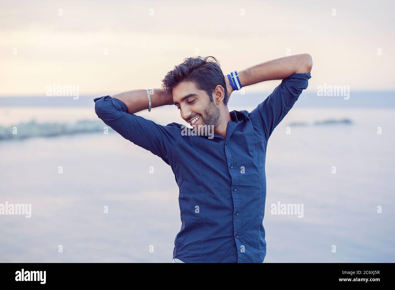 Man smiling looking up to blue sky taking deep breath celebrating ...