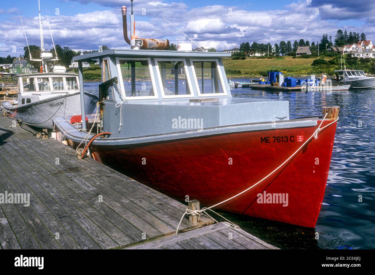 A fishing boat tied up at the dock at Bailey Island, Maine Stock Photo ...