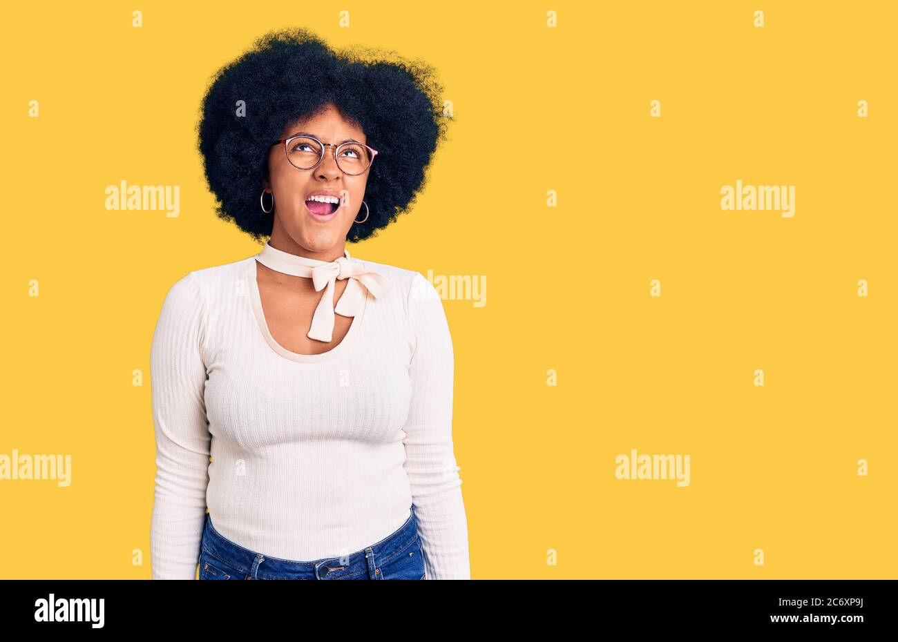 Young african american girl wearing casual clothes and glasses angry ...