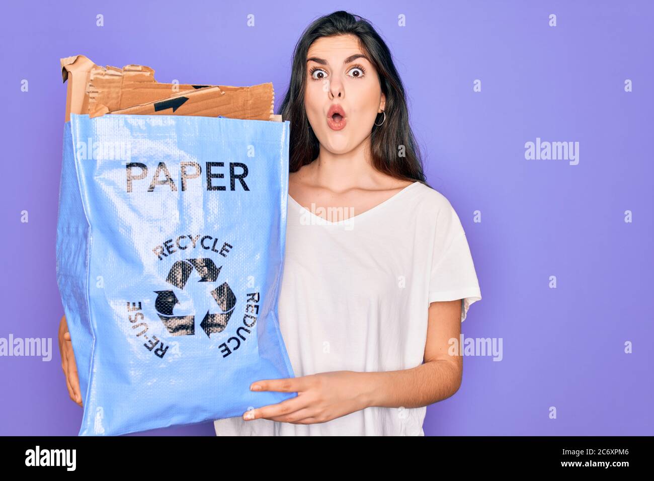 Young beautiful woman holding recycle cardboard bag containter recycling for eco environment ...