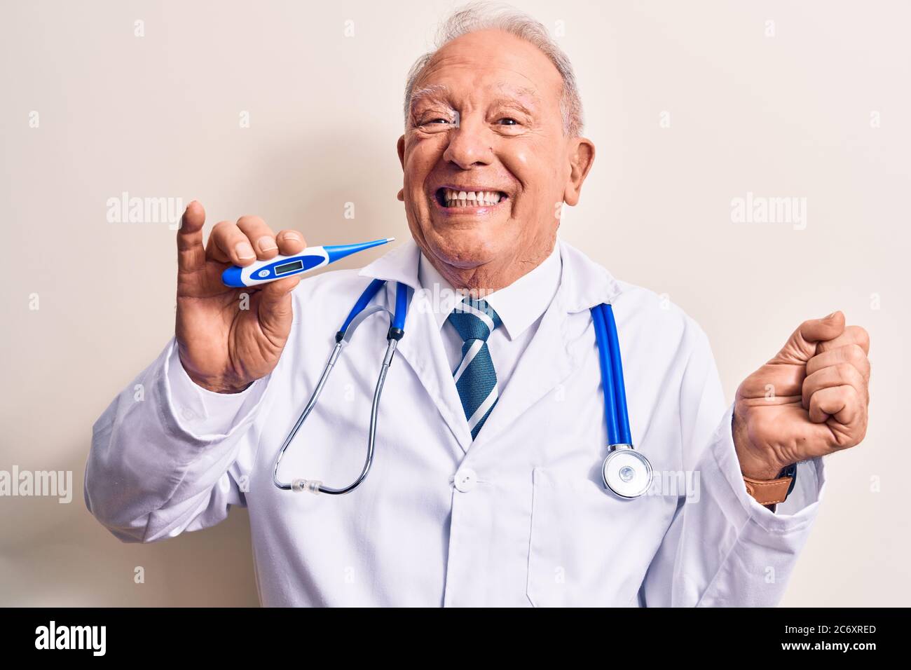 Senior grey-haired doctor man wearing stethoscope controlling ...