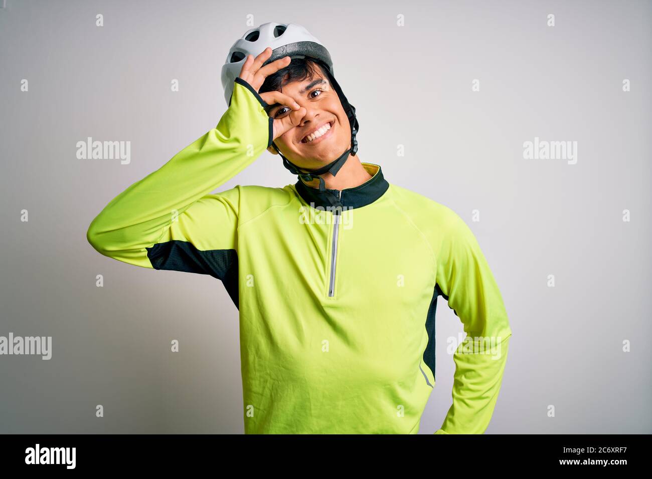 Young handsome cyclist man wearing security bike helmet over isolated ...