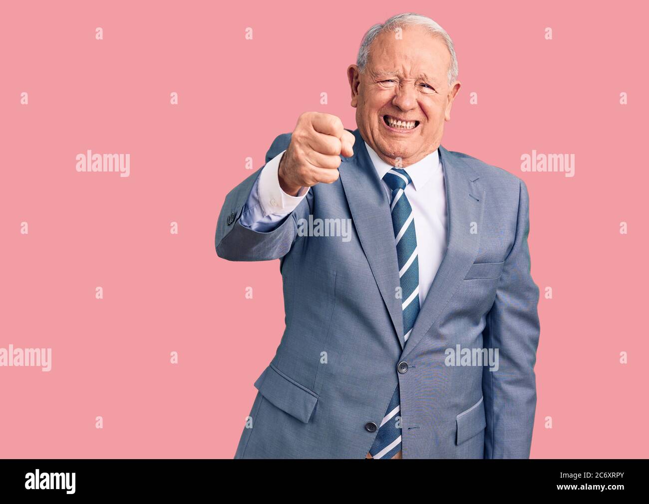 Senior handsome grey-haired man wearing elegant suit angry and mad ...