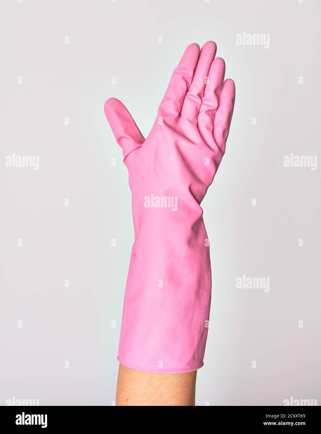 Hand of caucasian young woman wearing pink cleaning glove doing ...