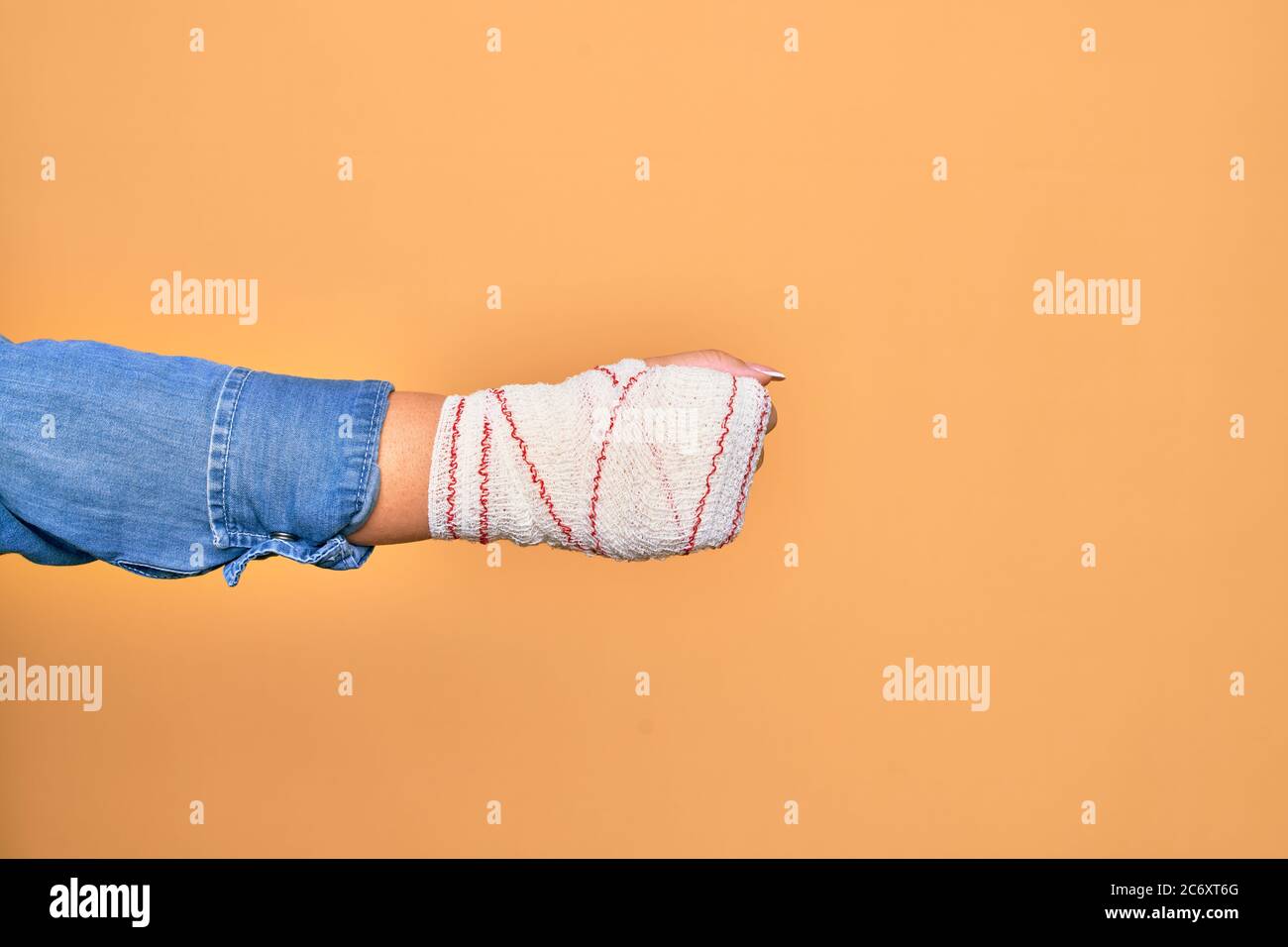 Wounded hand of caucasian young woman cover with bandage doing punch ...
