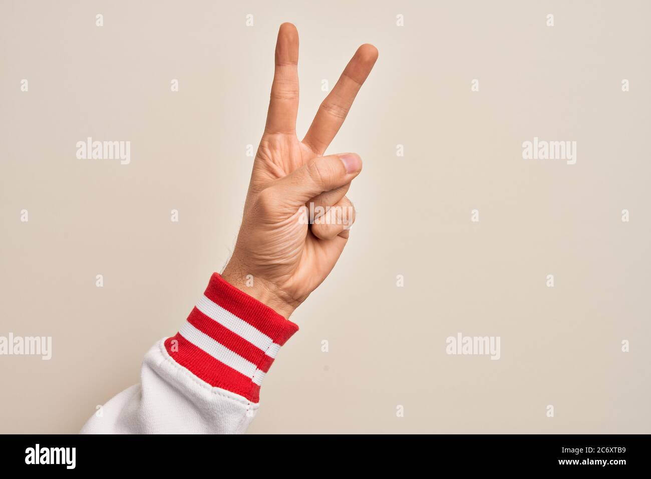 Hand of caucasian young man showing fingers over isolated white ...