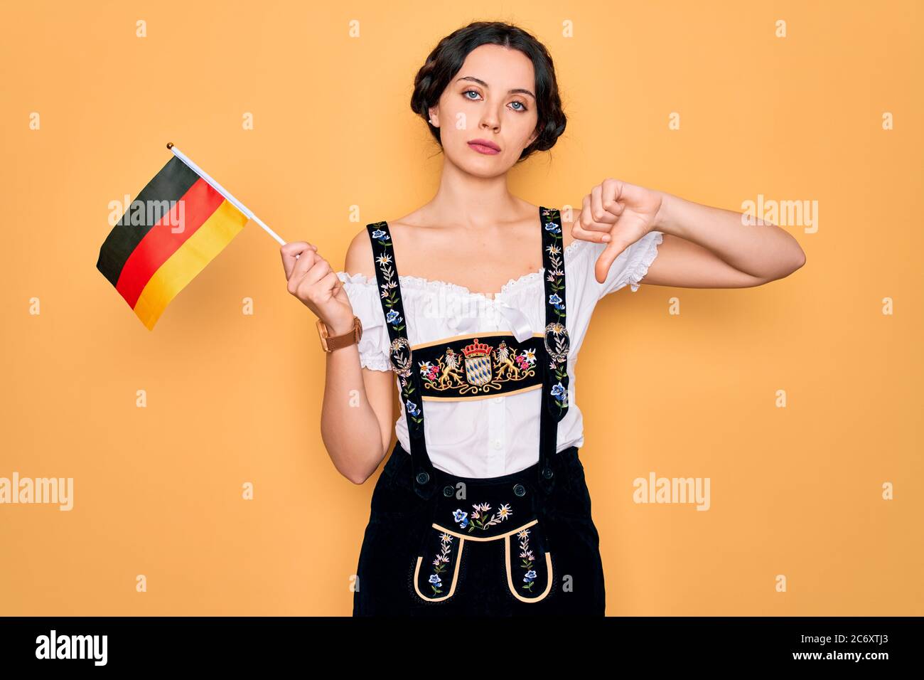 Young patriotic german woman with blue eyes wearing octoberfest dress ...