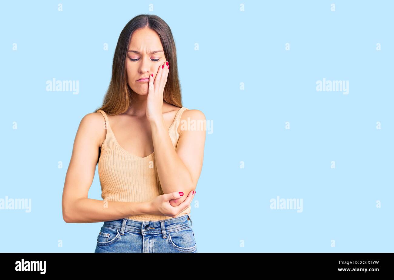 Beautiful brunette young woman wearing casual clothes thinking looking ...